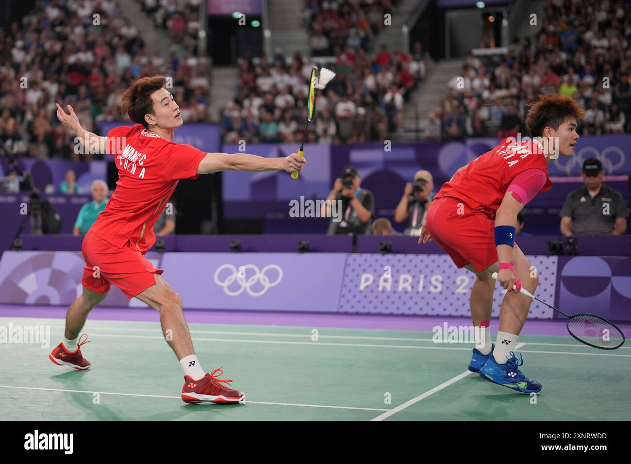China's Liang Weikeng and Wang Chang play against Malaysia's Aaron Chia ...