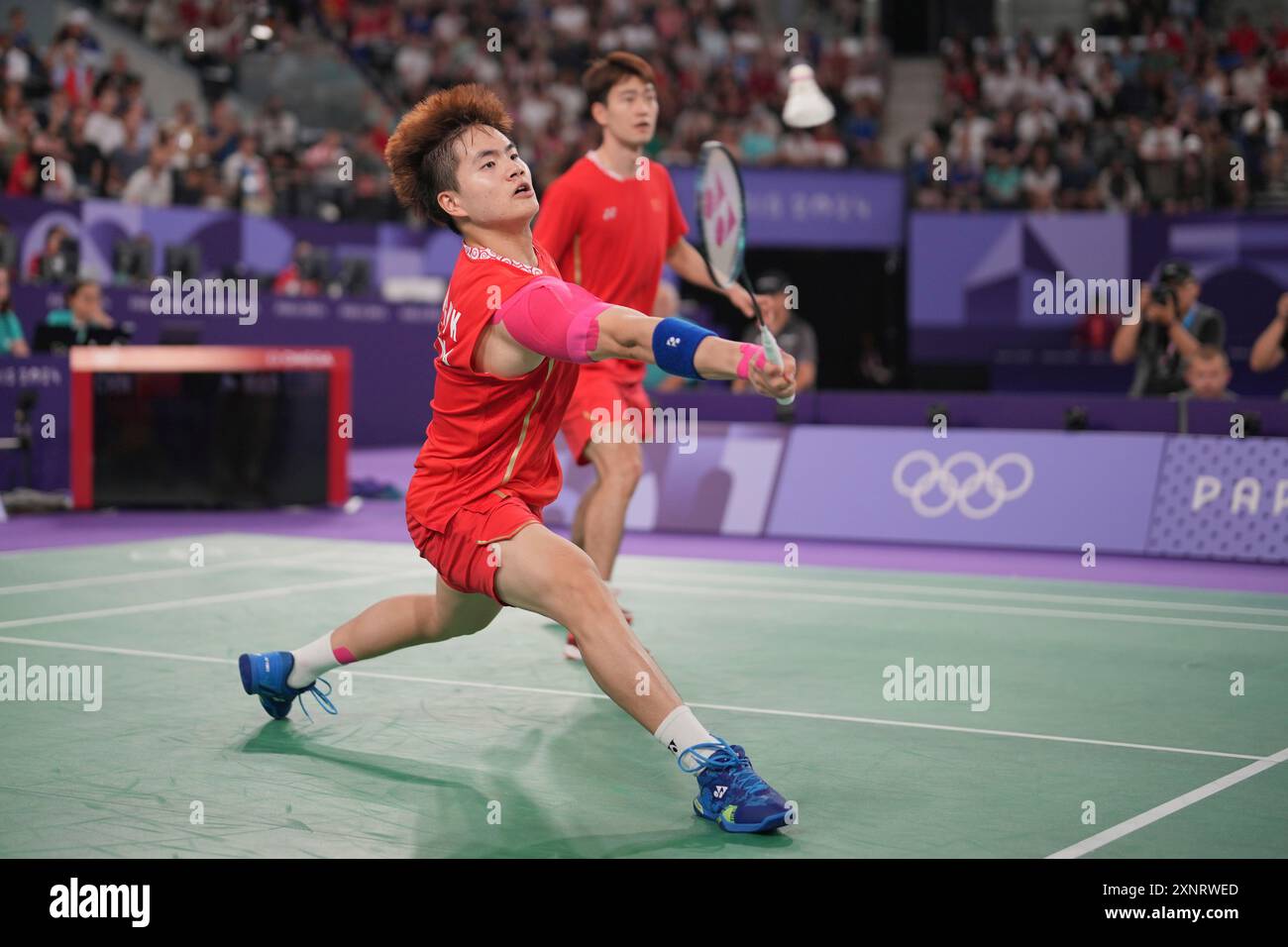 China's Liang Weikeng and Wang Chang play against Malaysia's Aaron Chia ...