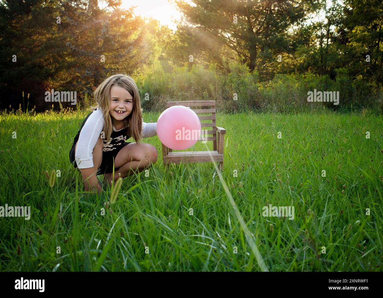 Happy young girl doing science experiment outdoors Stock Photo - Alamy