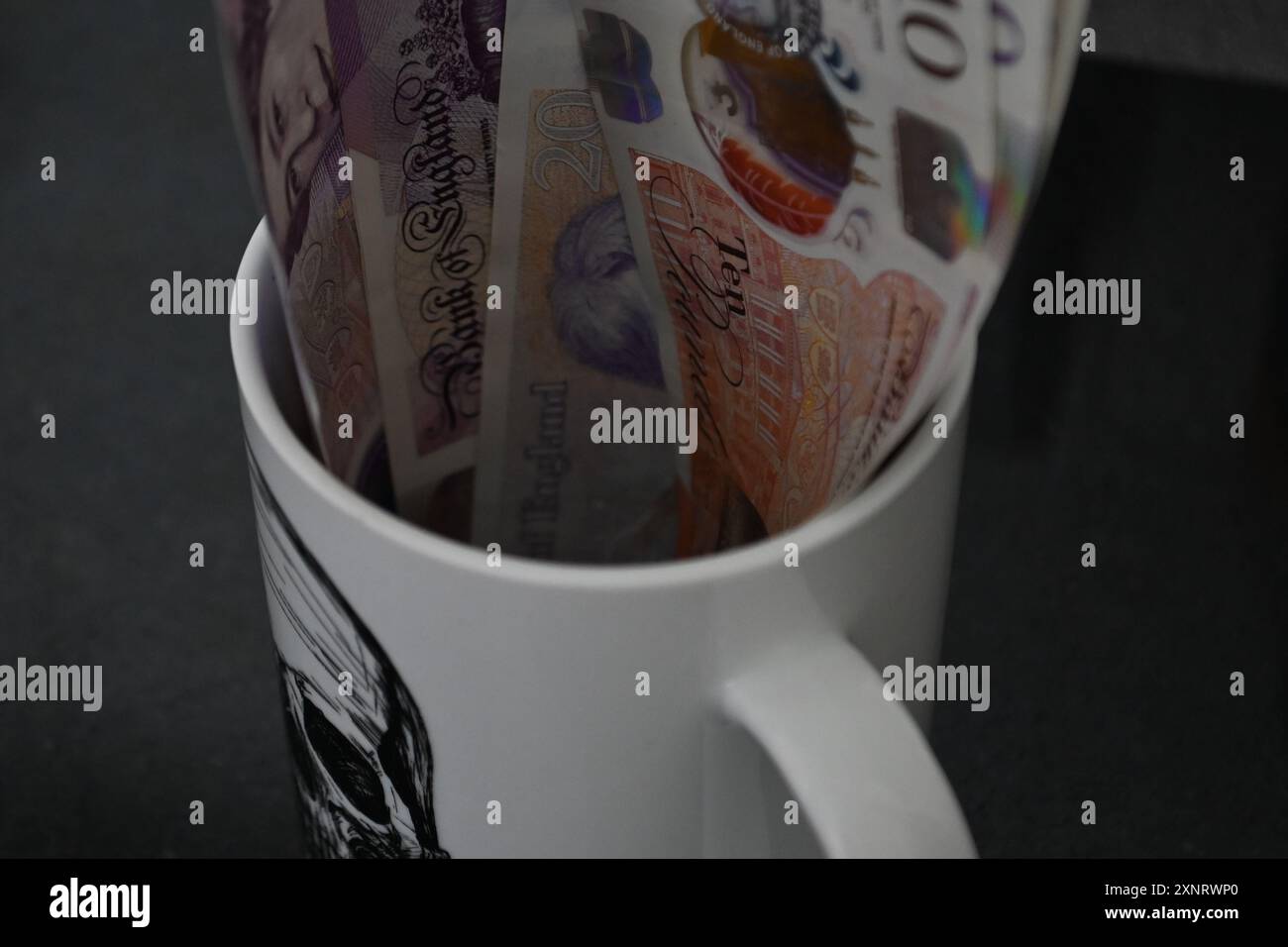 Cup O Cash Stock Photo - Alamy
