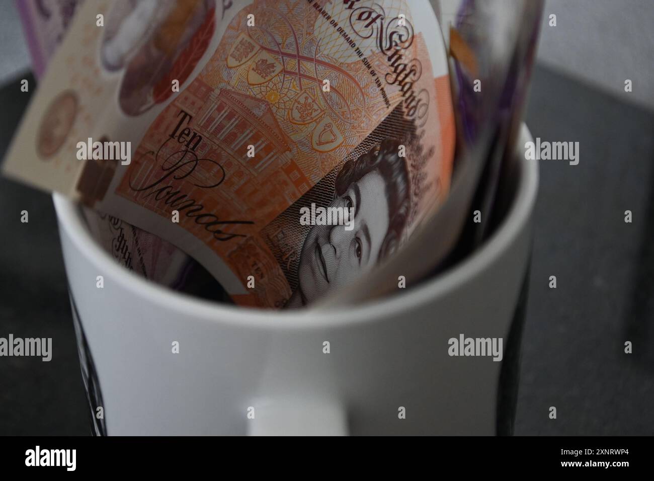 Mug of Cash Stock Photo - Alamy