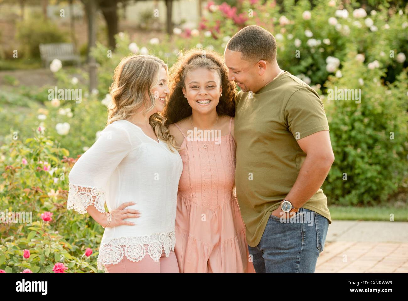 Biracial parents with teenage daughter Stock Photo - Alamy