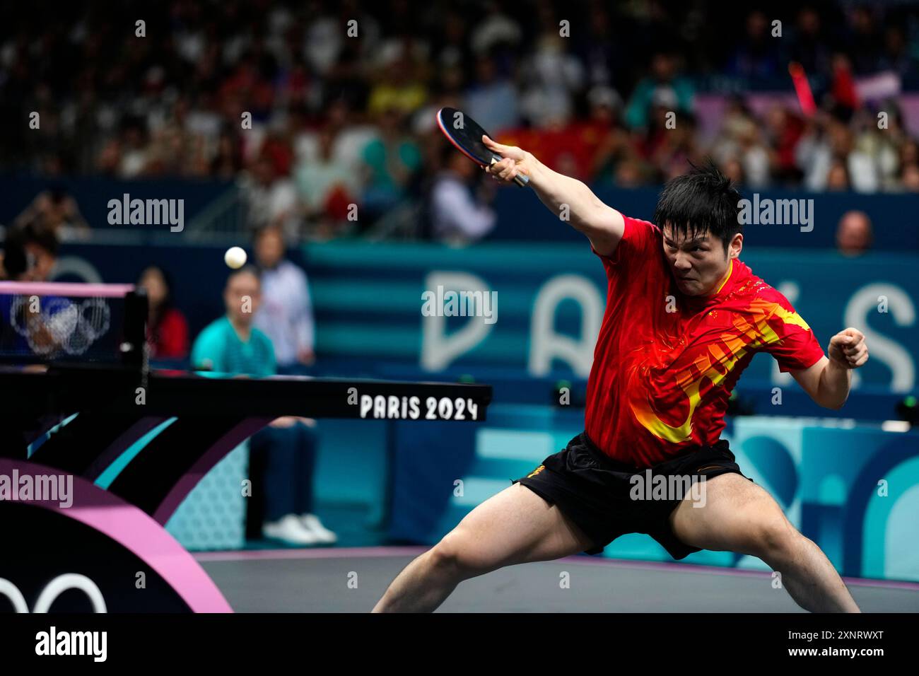 China's Fan Zhendong plays against France's Felix Lebrun during a men's ...