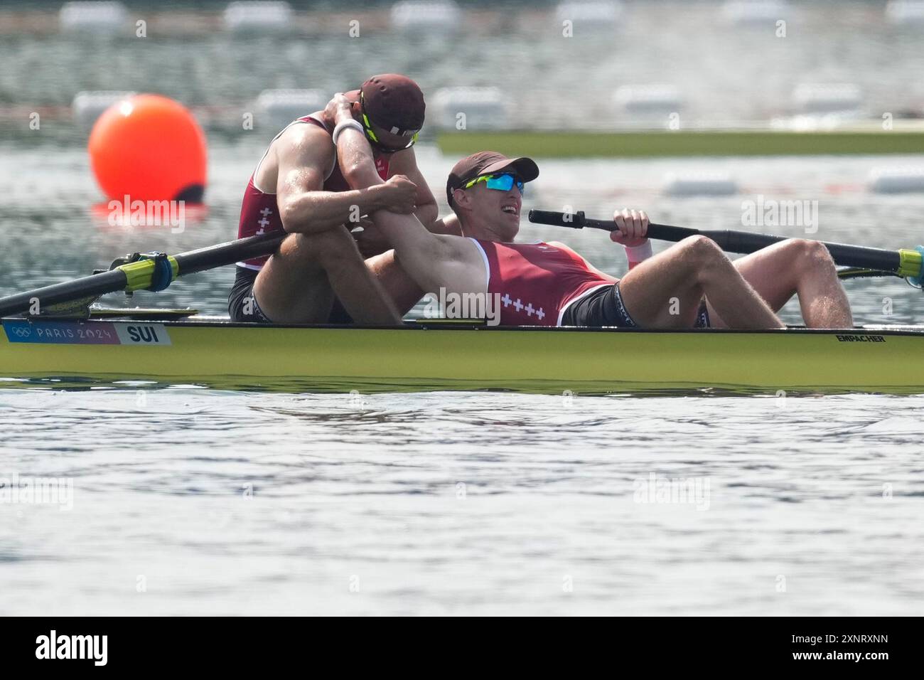 Switzerland's Roman Roeoesli and Andrin Gulich celebrate a bronze medal ...