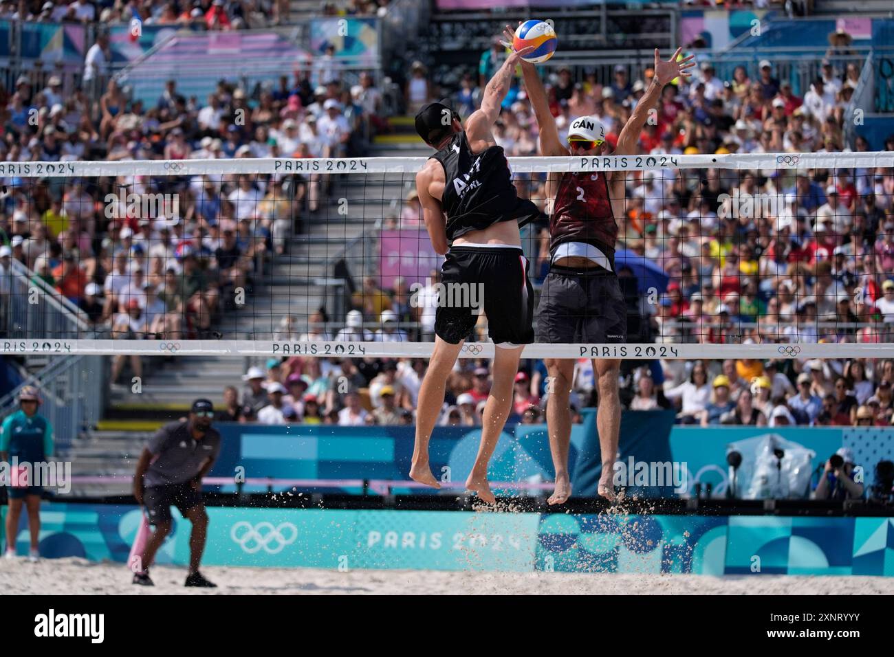 in a beach volleyball match at the 2024 Summer Olympics, Friday, Aug. 2 ...