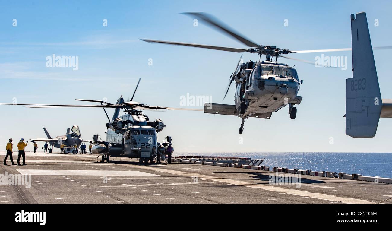 240730-N-TW227-1075 PHILIPPINE SEA (July 30, 2024) An MH-60S Seahawk ...