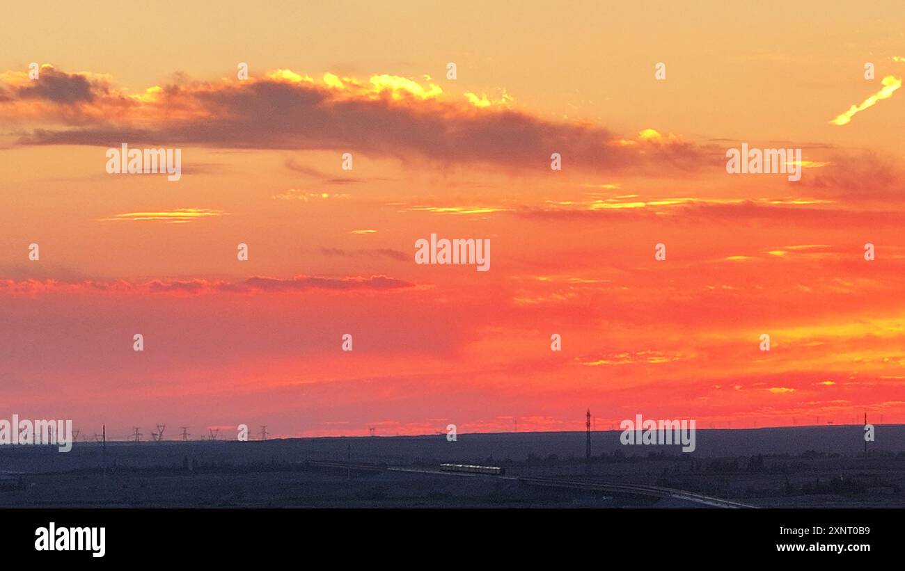 HAMI, CHINA - AUGUST 1, 2024 - Colorful fire clouds are seen on the ...