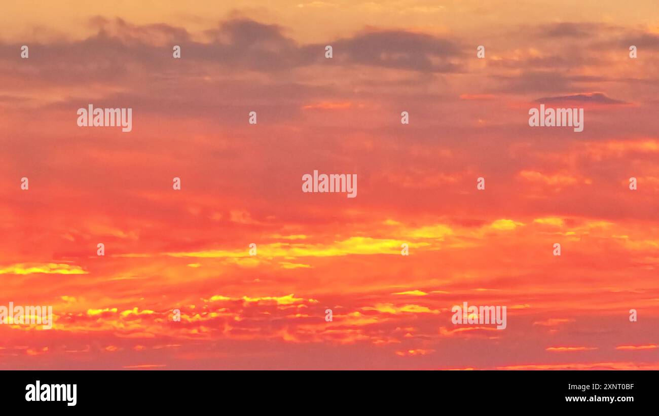 HAMI, CHINA - AUGUST 1, 2024 - Colorful fire clouds are seen on the ...