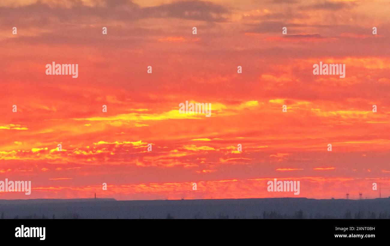 HAMI, CHINA - AUGUST 1, 2024 - Colorful fire clouds are seen on the ...