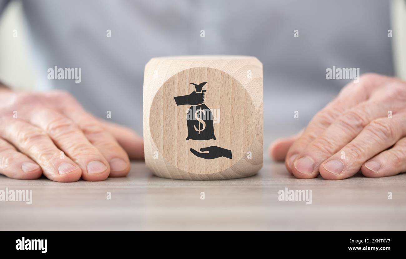 Wooden block with symbol of money transfer concept Stock Photo - Alamy