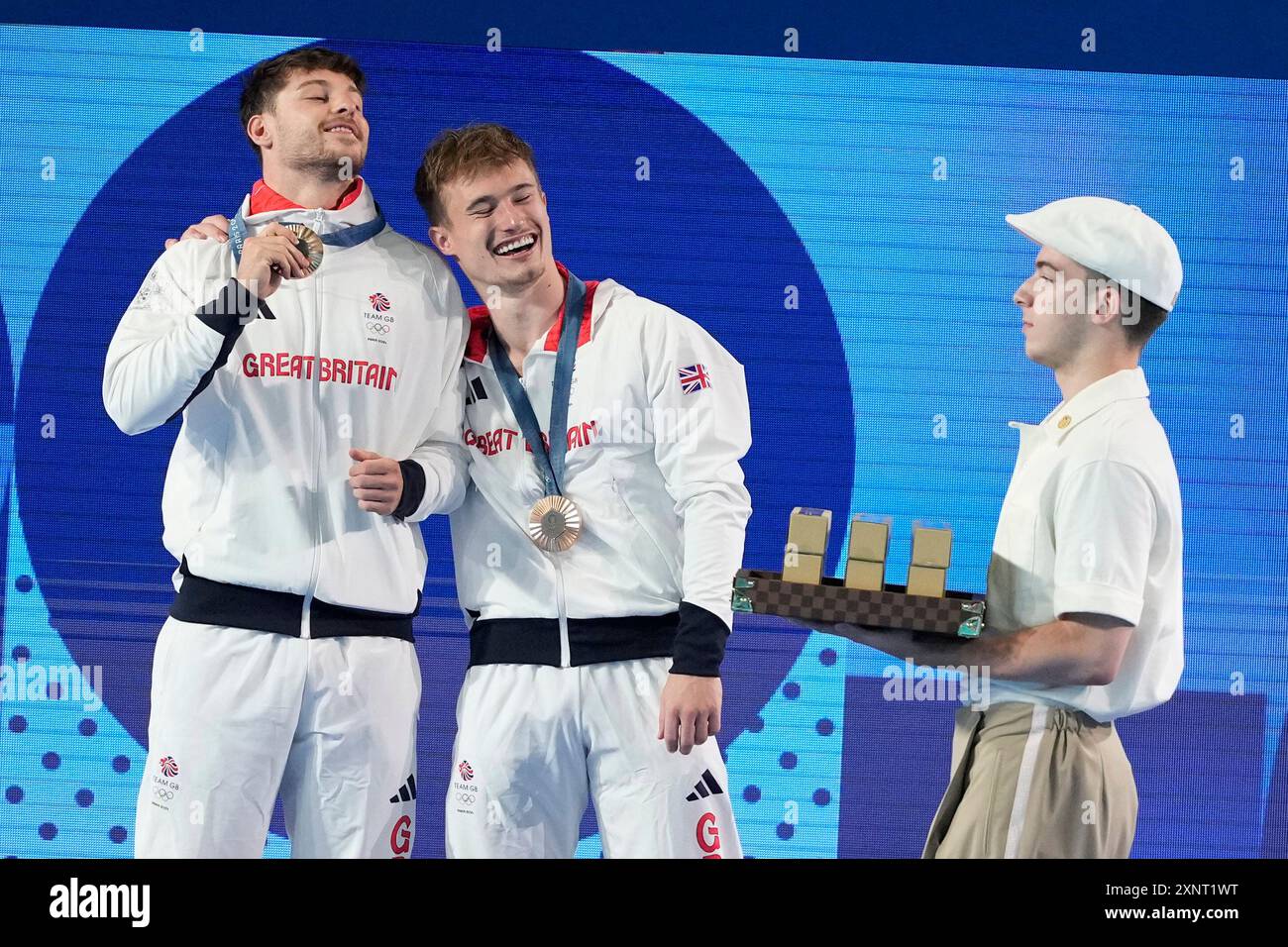 Britain's Anthony Harding and Jack Laugher hold the bronze medal on the ...