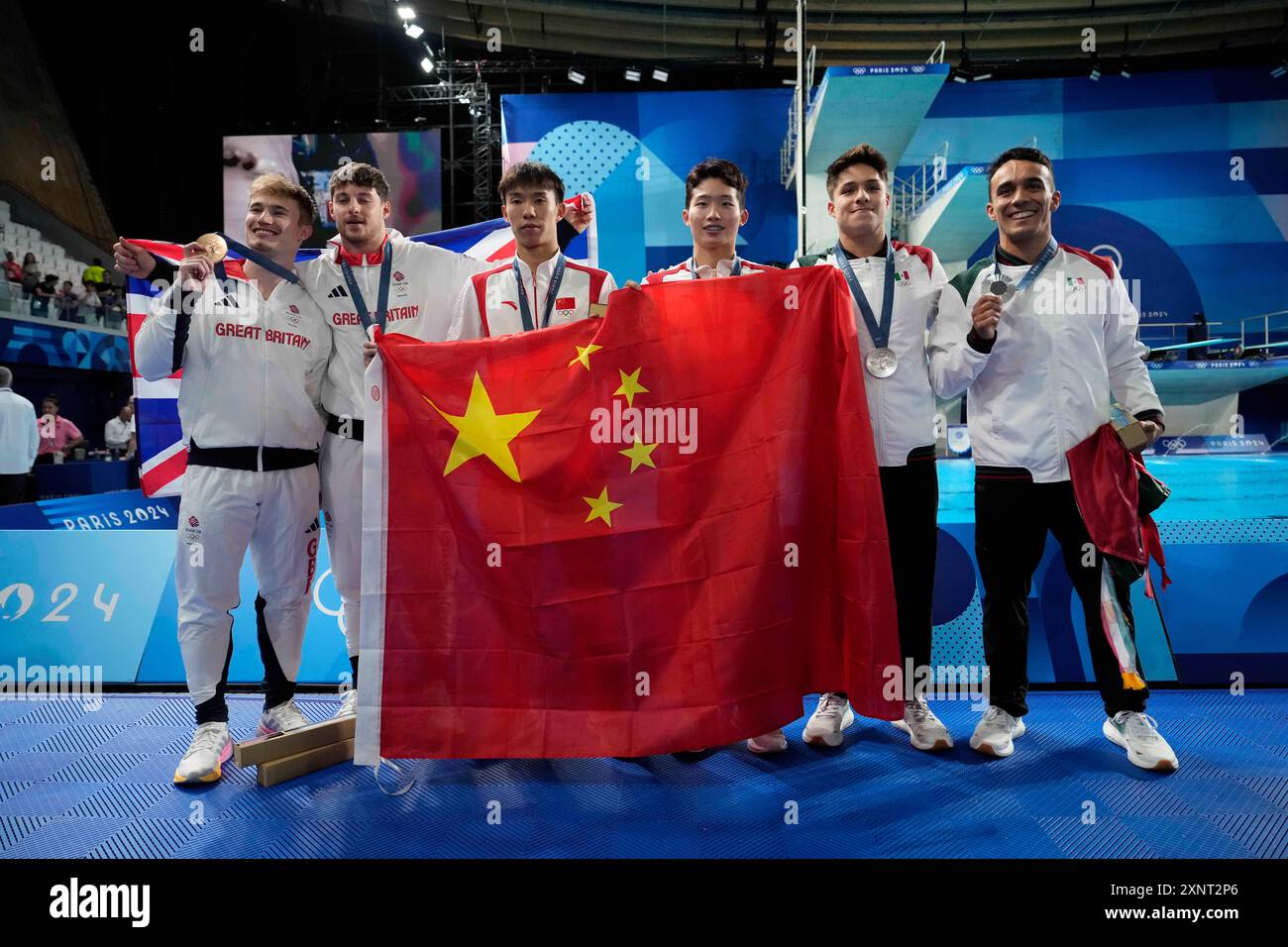China's Long Daoyi and Wang Zongyuan, center, celebrate their gold ...