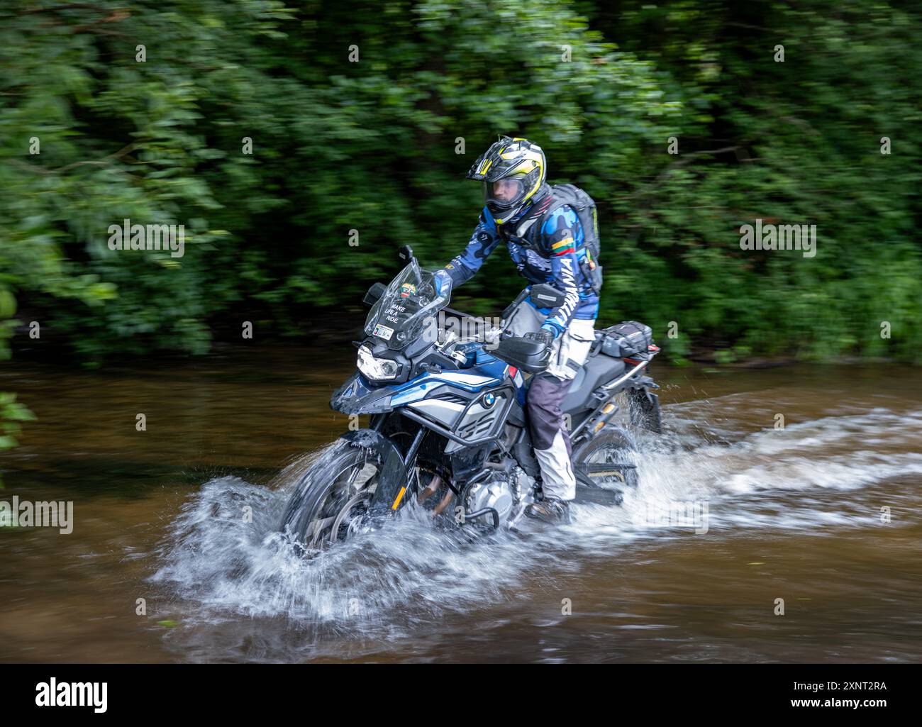 Man rides motorcycle through mud hi-res stock photography and images ...