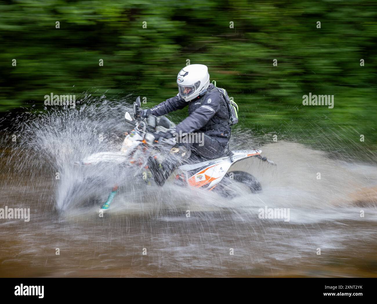 Man rides motorcycle through mud hi-res stock photography and images ...