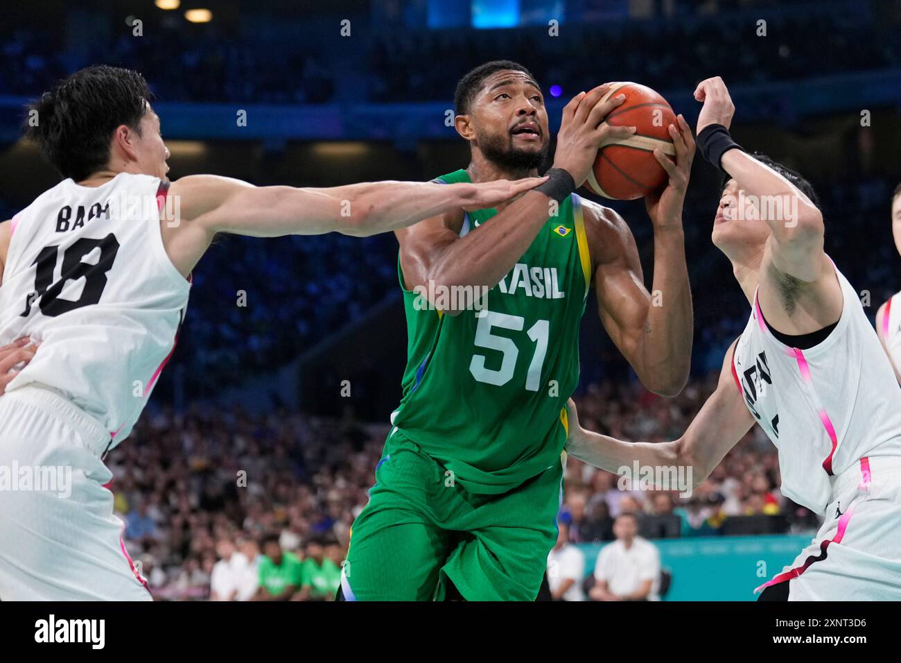 Bruno Caboclo, of Brazil shoots between Yudai Baba, left, and Yuta ...