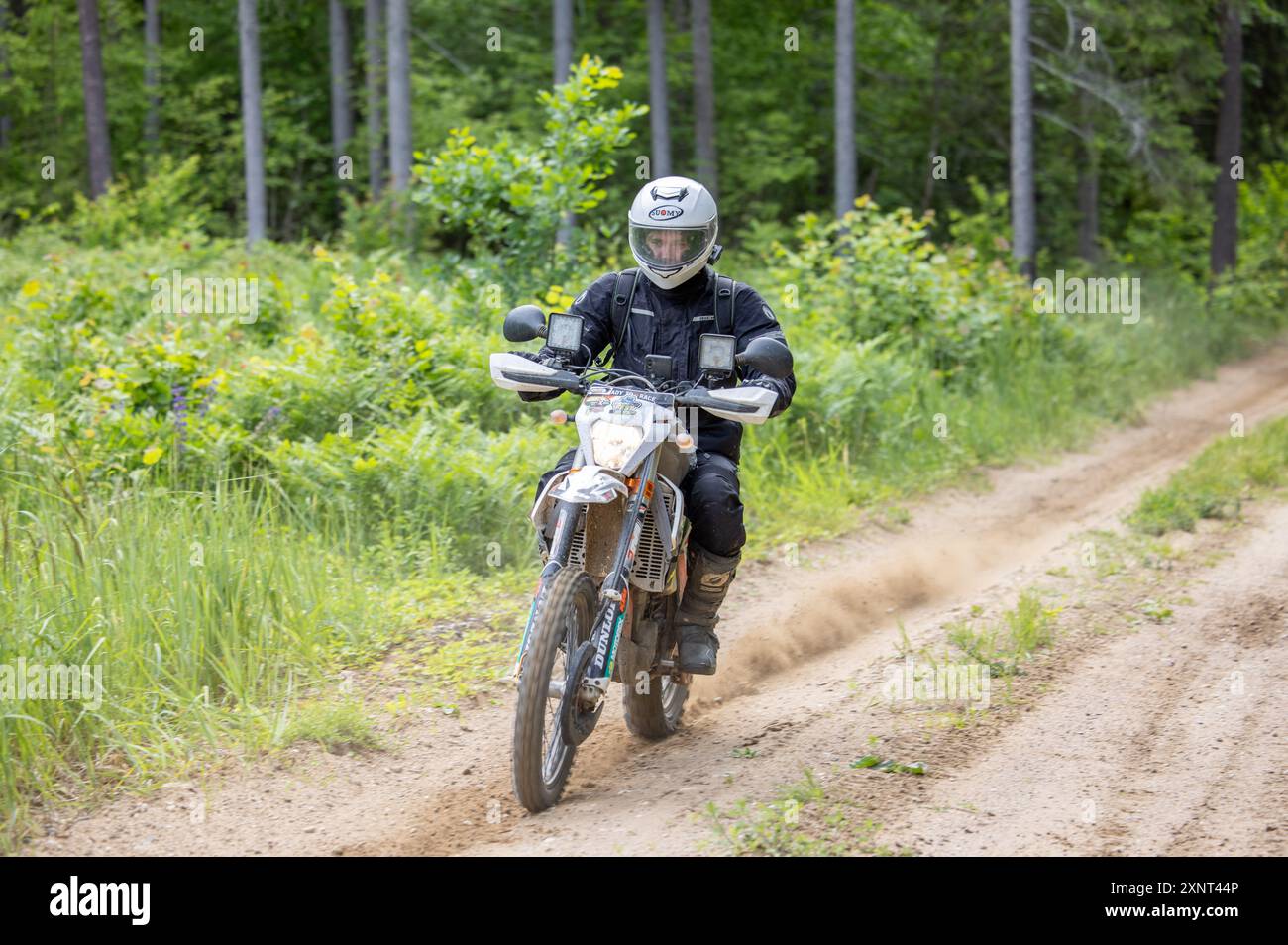 Man rides motorcycle through mud hi-res stock photography and images ...