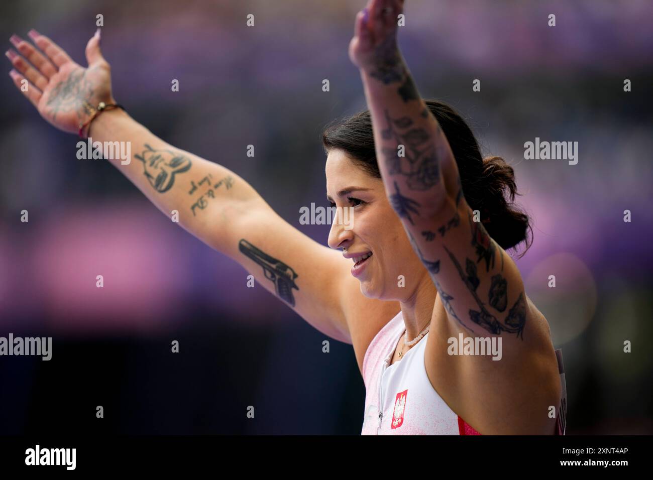 Ewa Swoboda, of Poland, wins a heat in the women's 100-meter run at the ...