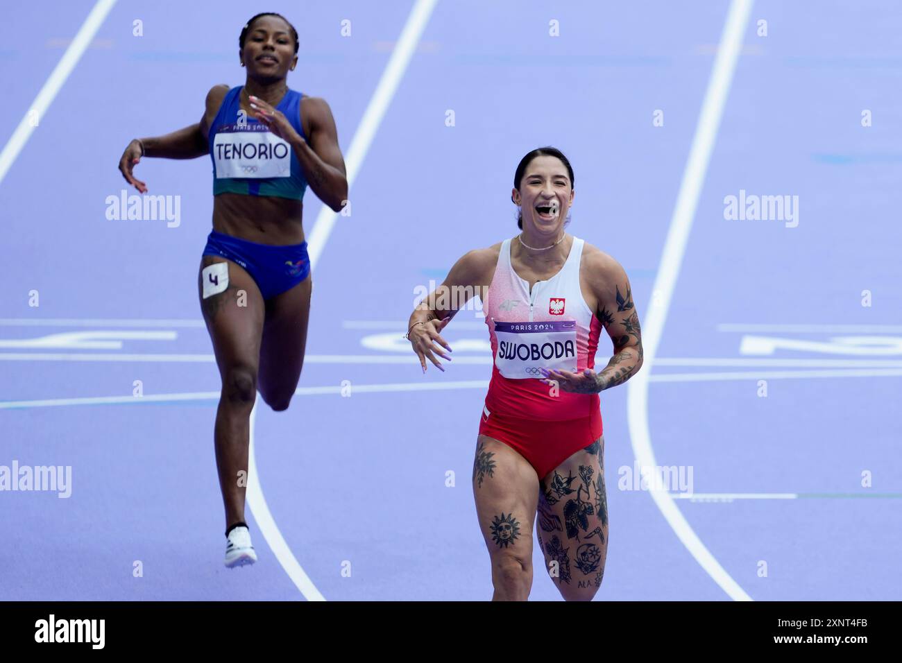 Ewa Swoboda, of Poland, wins a heat in the women's 100-meter run at the ...
