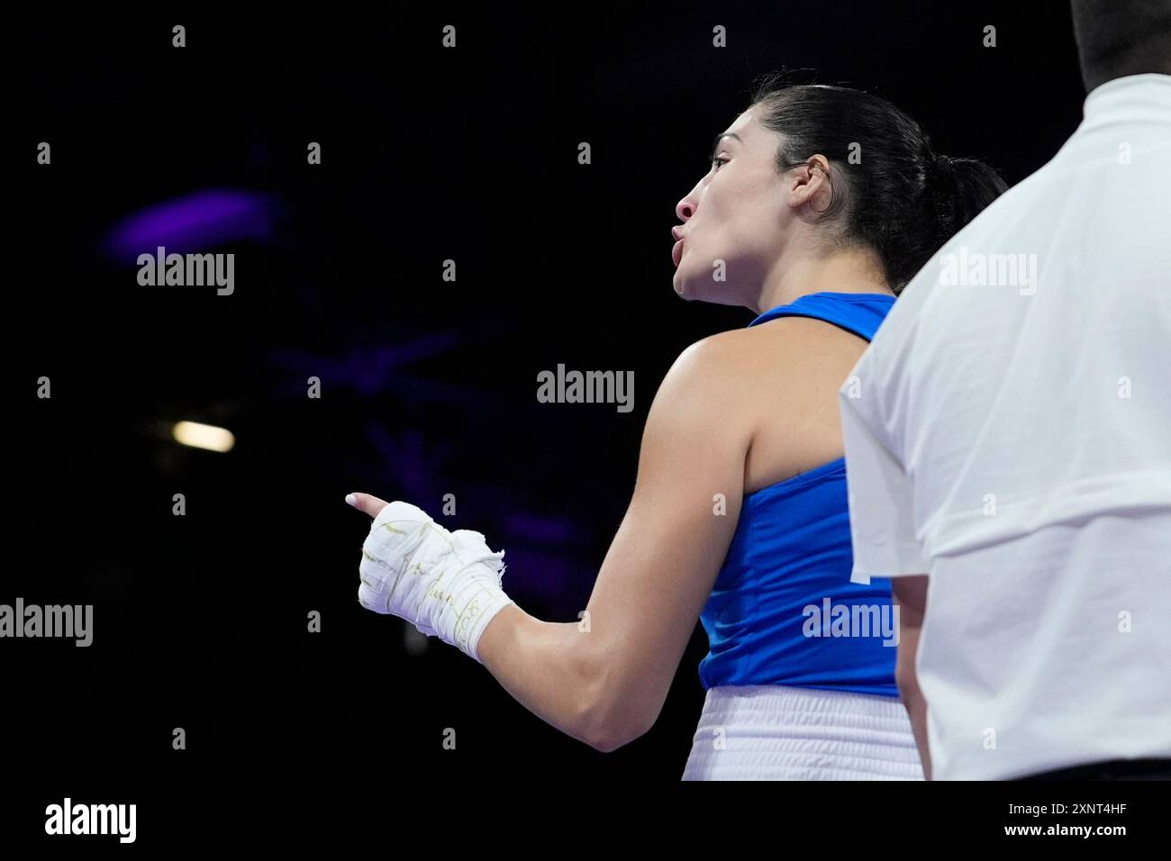 Italy's Angela Carini speaks with her corner in after abandoning her ...