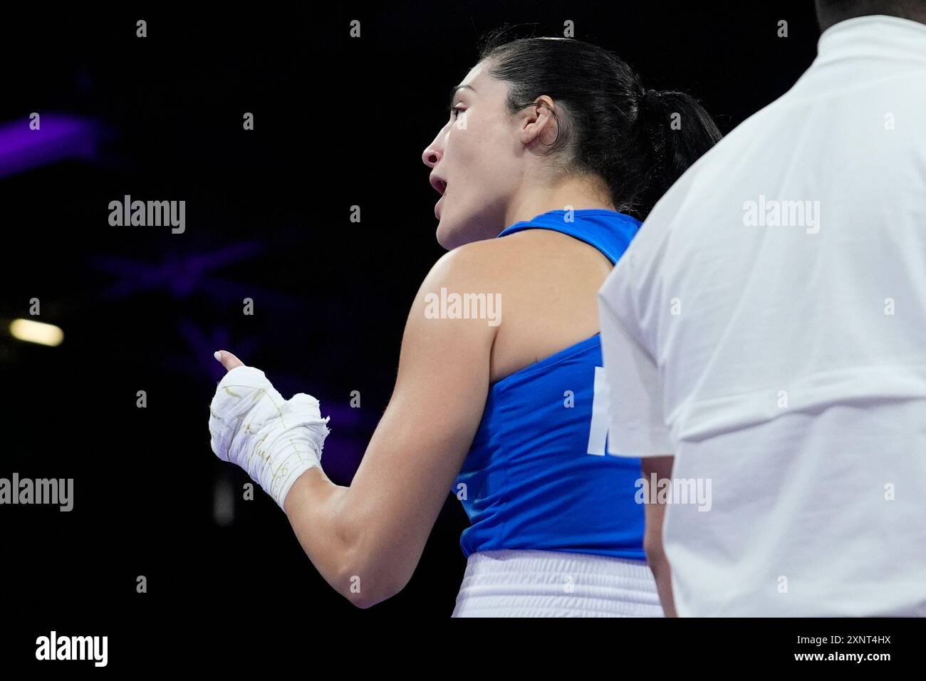 Italy's Angela Carini speaks with her corner in after abandoning her ...