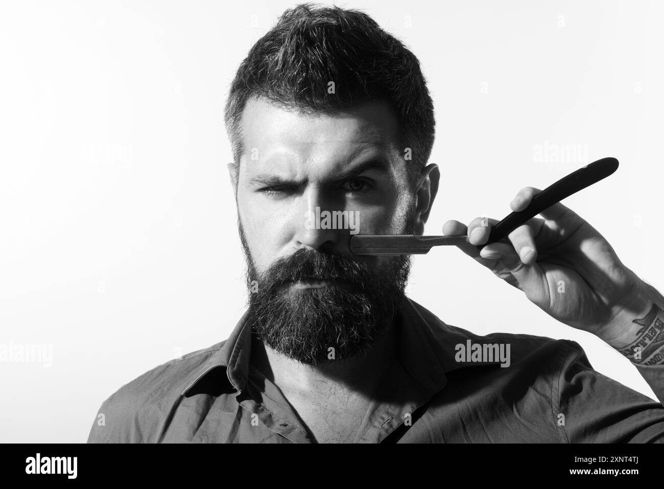 Professional barber tools. Bearded man ready to shaving his beard with ...