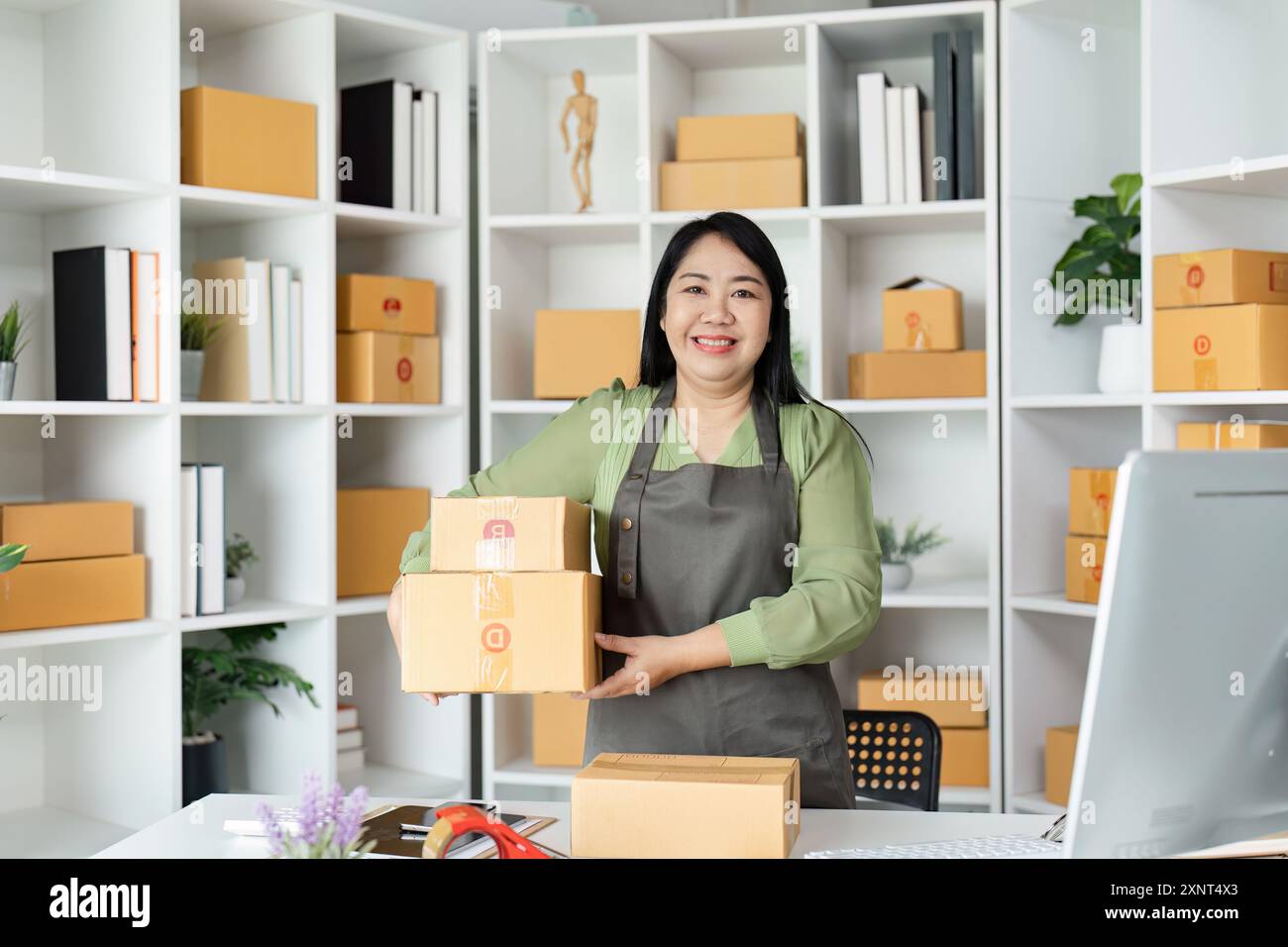 Senior Entrepreneur Starting a Business - Confident Woman Packing Boxes ...