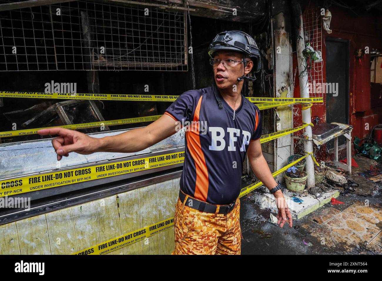 Manila, Philippines. 2nd Aug, 2024. A fire investigator from the ...