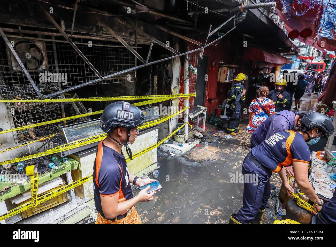 Manila, Philippines. 2nd Aug, 2024. Fire investigators from the ...