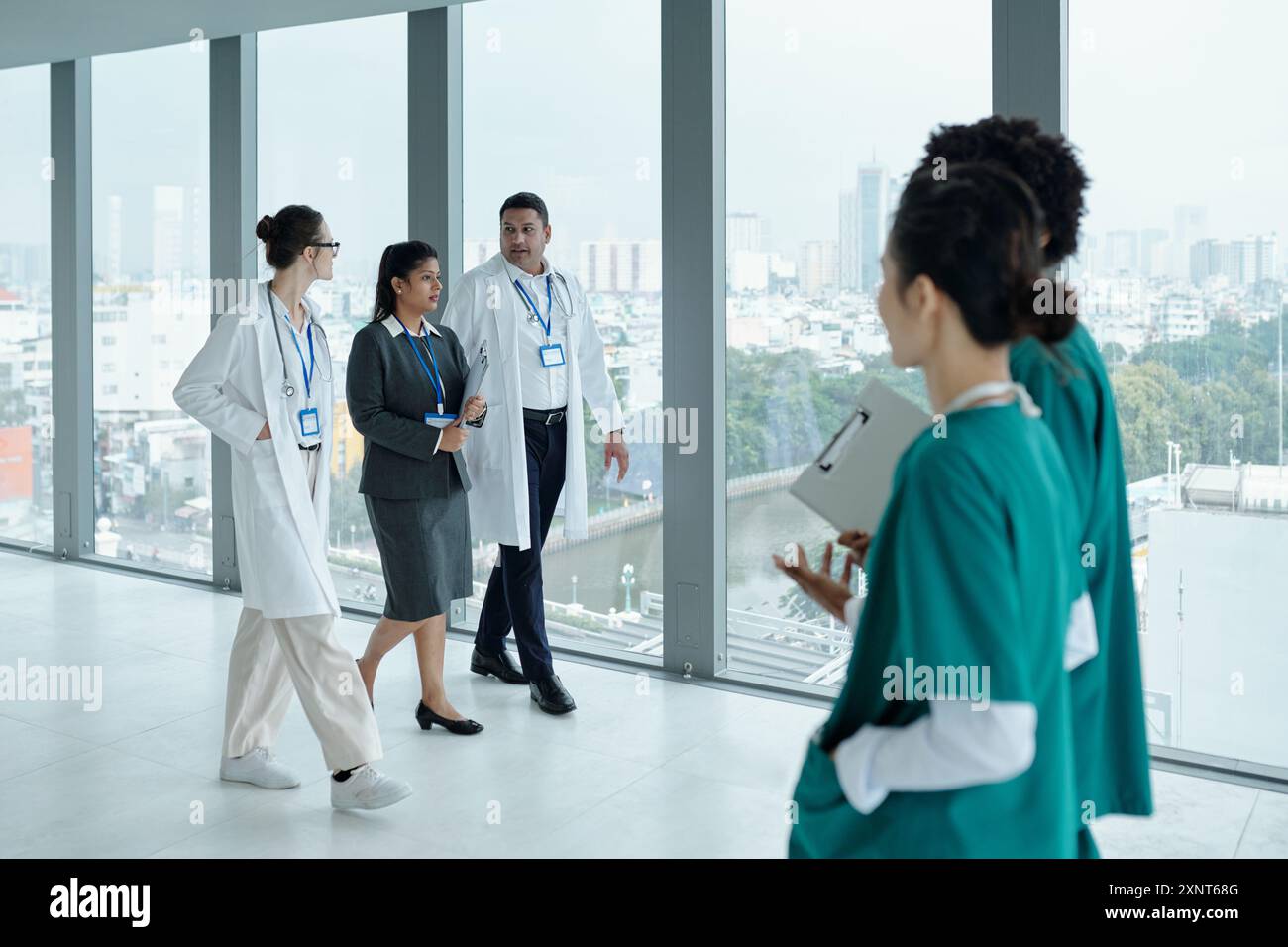 People Walking In Hospital Corridor Stock Photo - Alamy