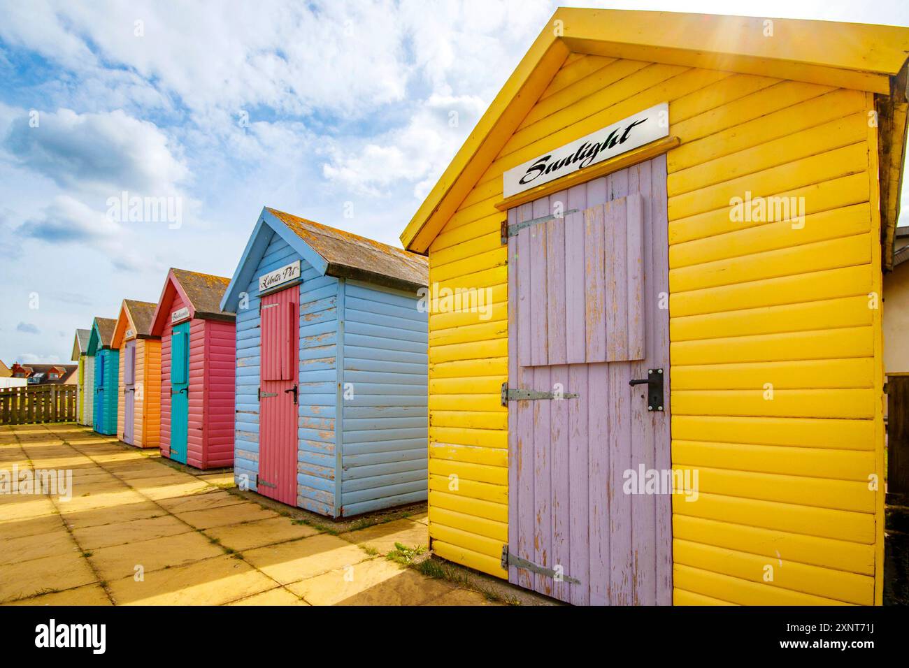 multi coloured colourful beach huts sheds by the sea Amble ...