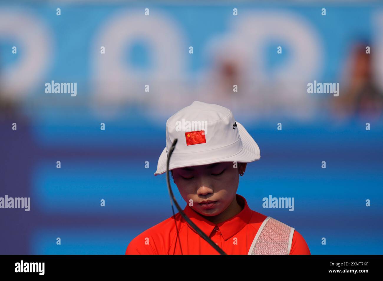 China's Xiaolei Yang looks down during the Archery mixed team elimination round against Spain at ...