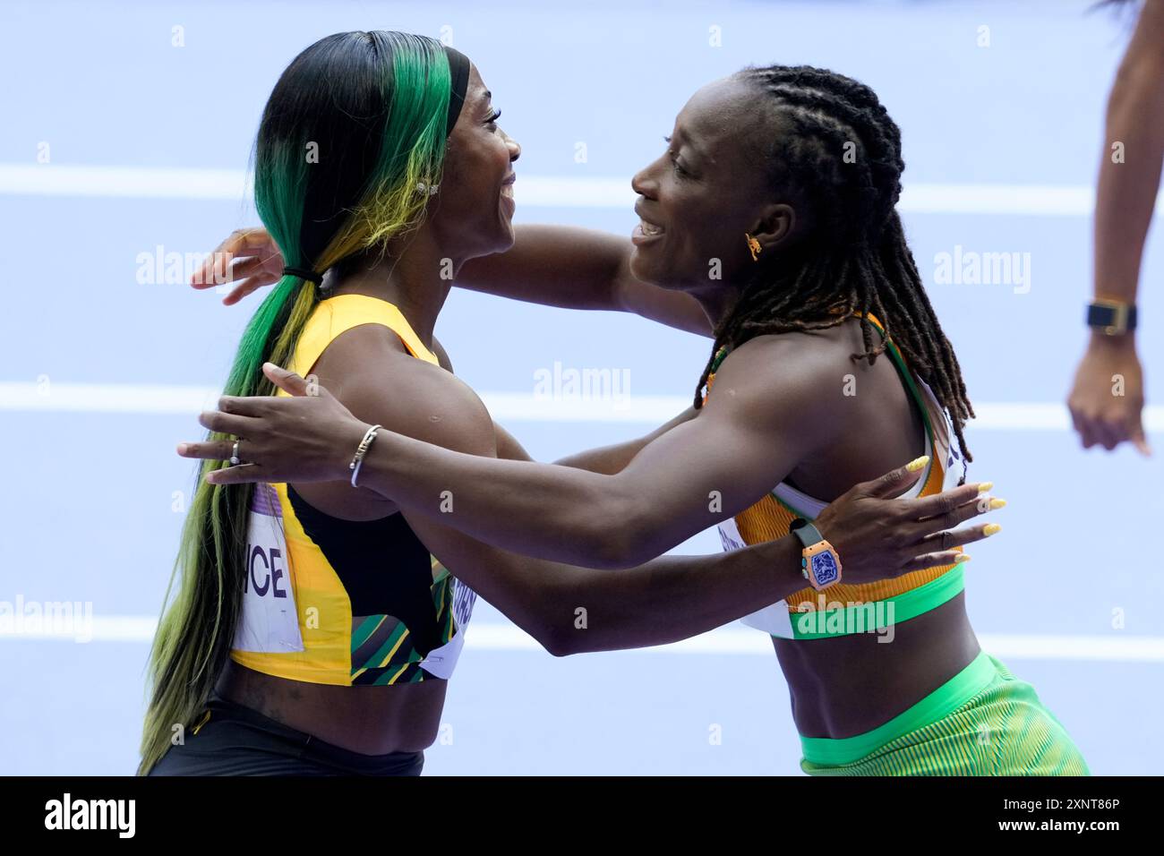 Marie-Josee Ta Lou-Smith, of Cote D'Ivoire, and Shelly-Ann Fraser-Pryce ...
