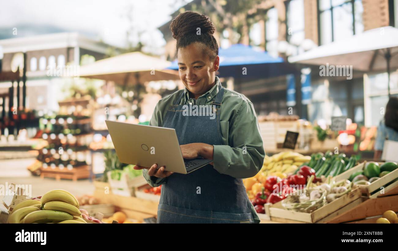 Farmer using laptop computer market hi-res stock photography and images ...