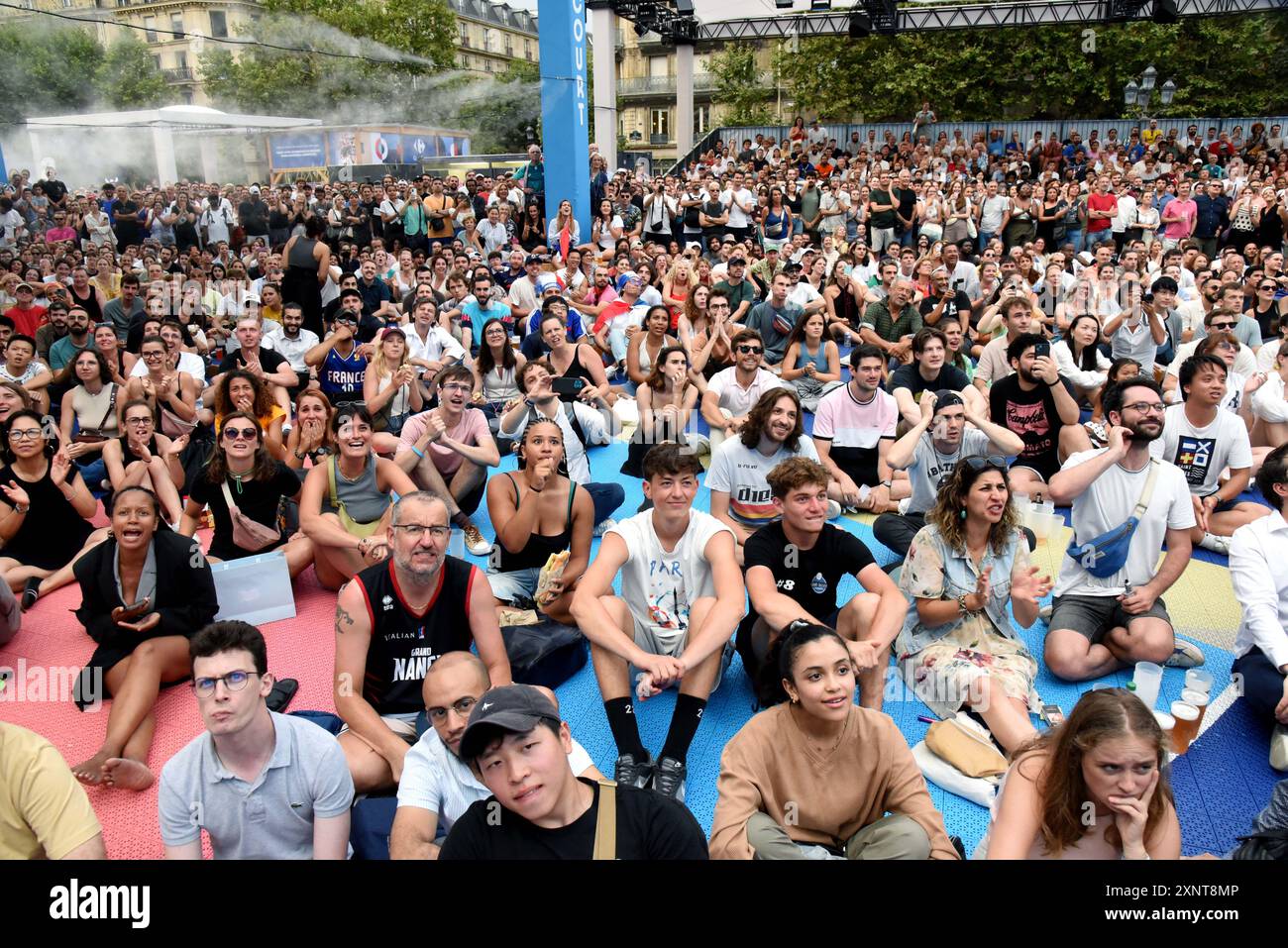 Paris, France. 01st Aug, 2024. Spectators look at a giant screen ...