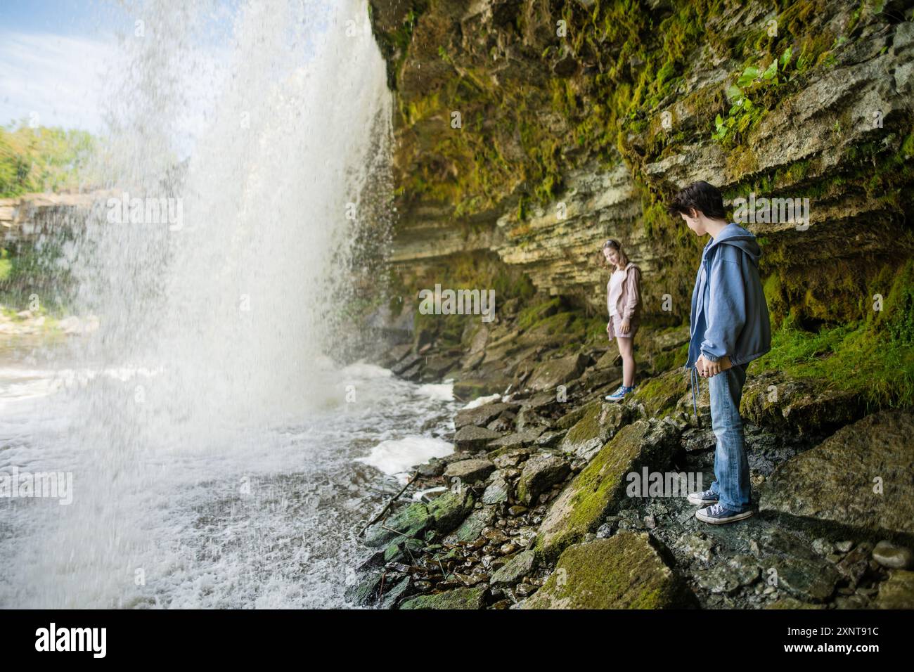 Teenage girls admiring Jagala Waterfall or Jagala juga, the widest ...
