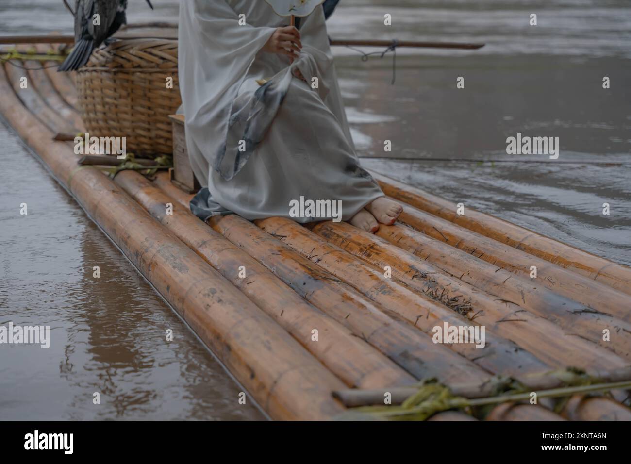 Detailed closeup of barefoot feet of Hanfu woman on bamboo raft by Li ...