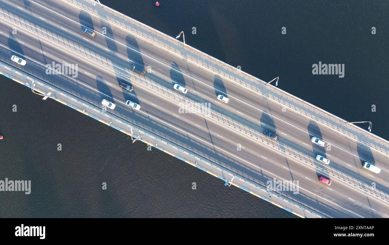 Aerial top view of bridge road automobile traffic of many cars from ...