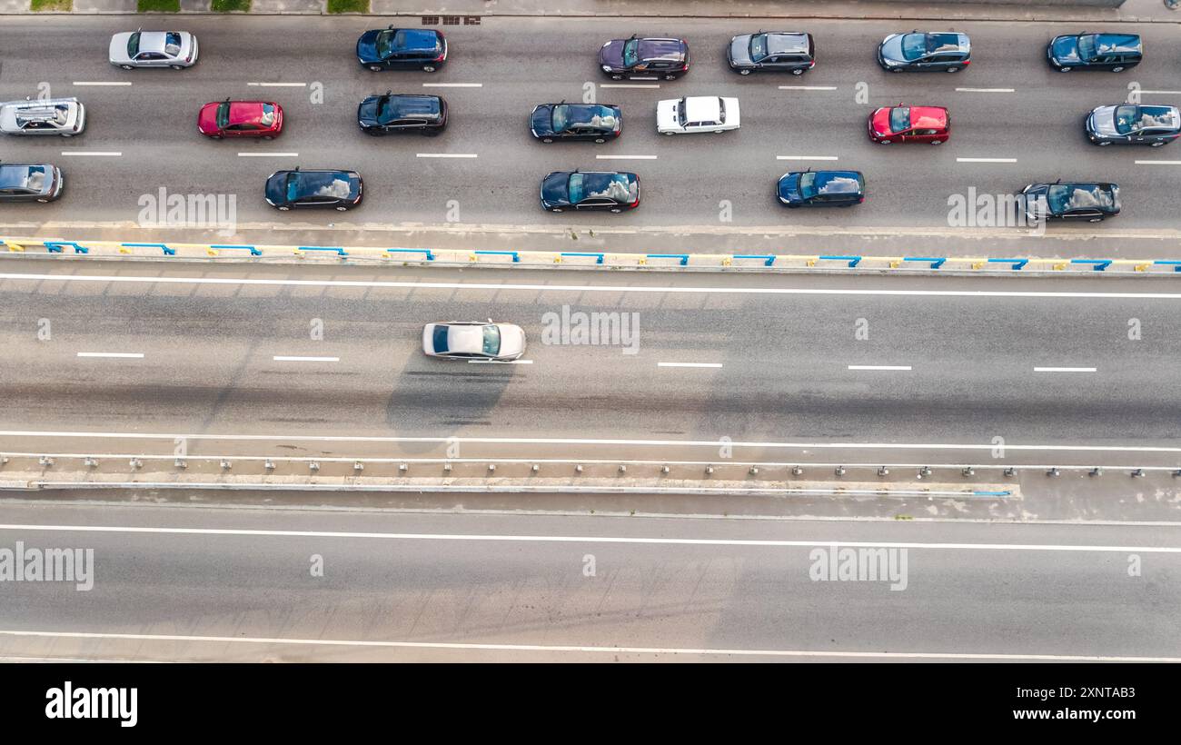 Aerial top view of road automobile traffic of many cars on highway from ...