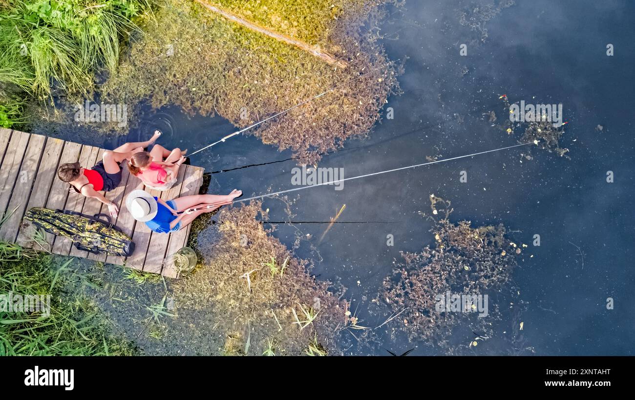 Young woman fishing pond in hi-res stock photography and images - Alamy