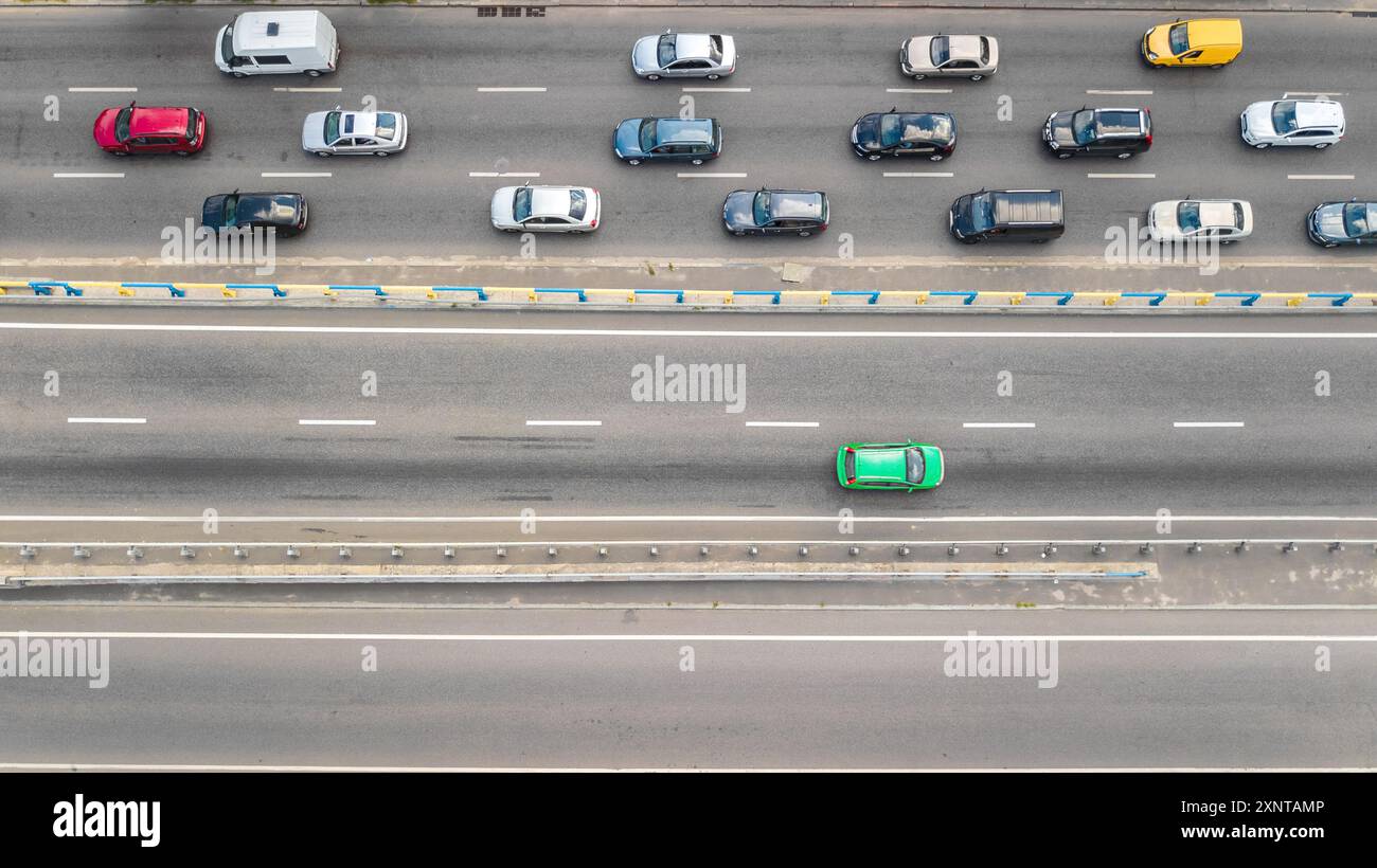 Aerial top view of road automobile traffic of many cars on highway from ...