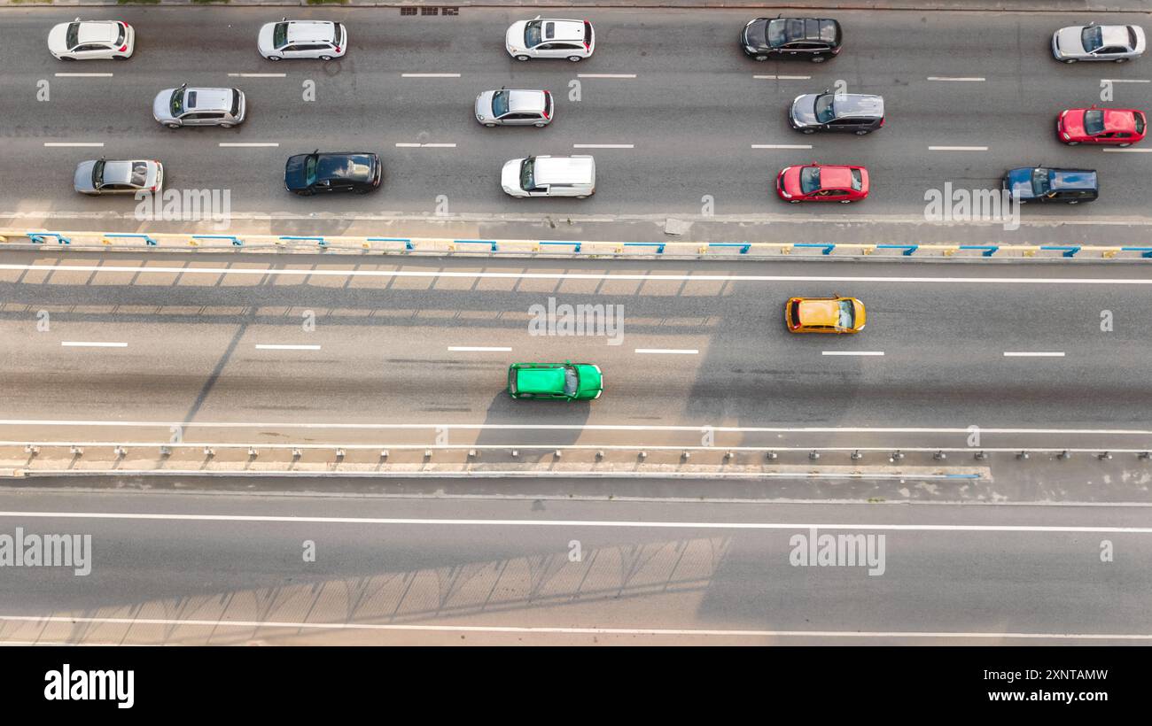 Aerial top view of road automobile traffic of many cars on highway from ...