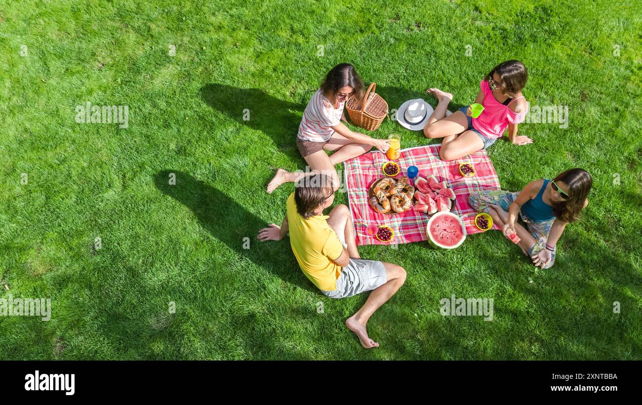 Happy family with children having picnic in park, parents with kids ...