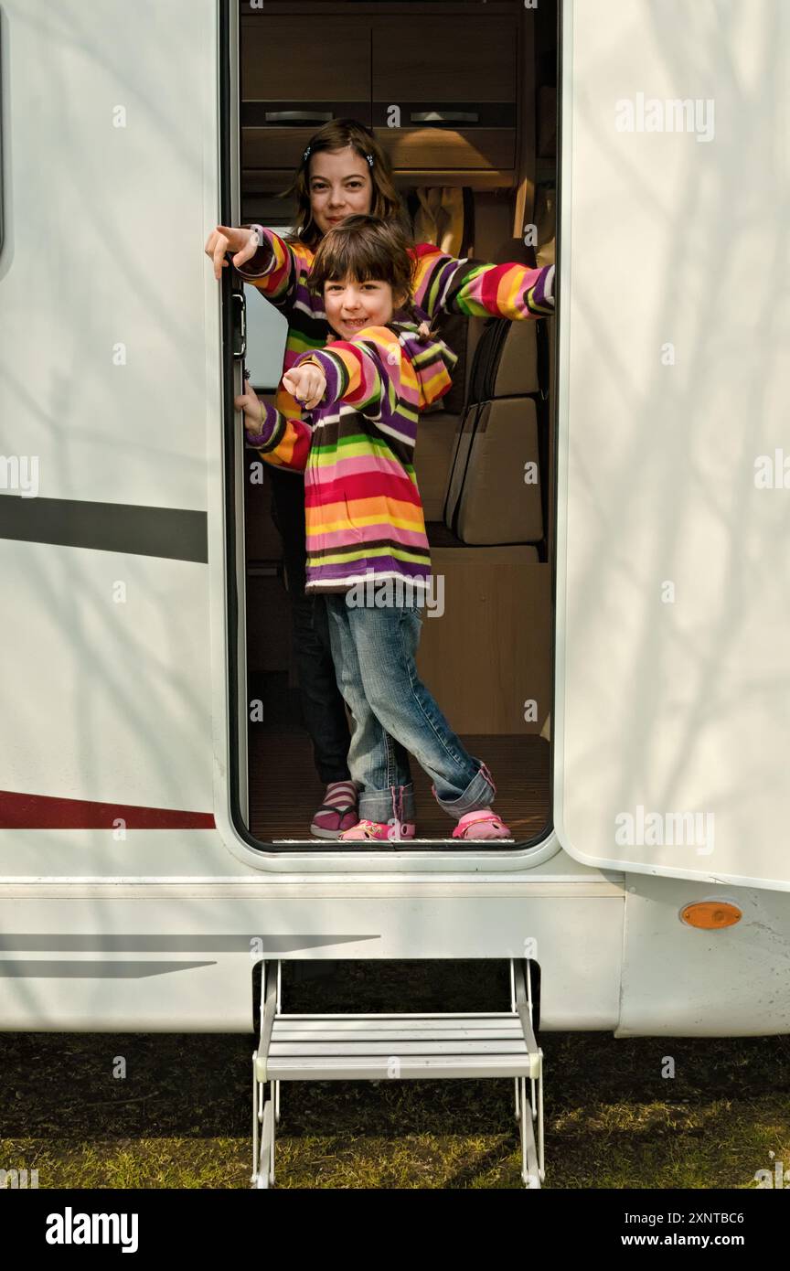 Kids in camper (rv) have fun, family travel in motorhome on holiday ...