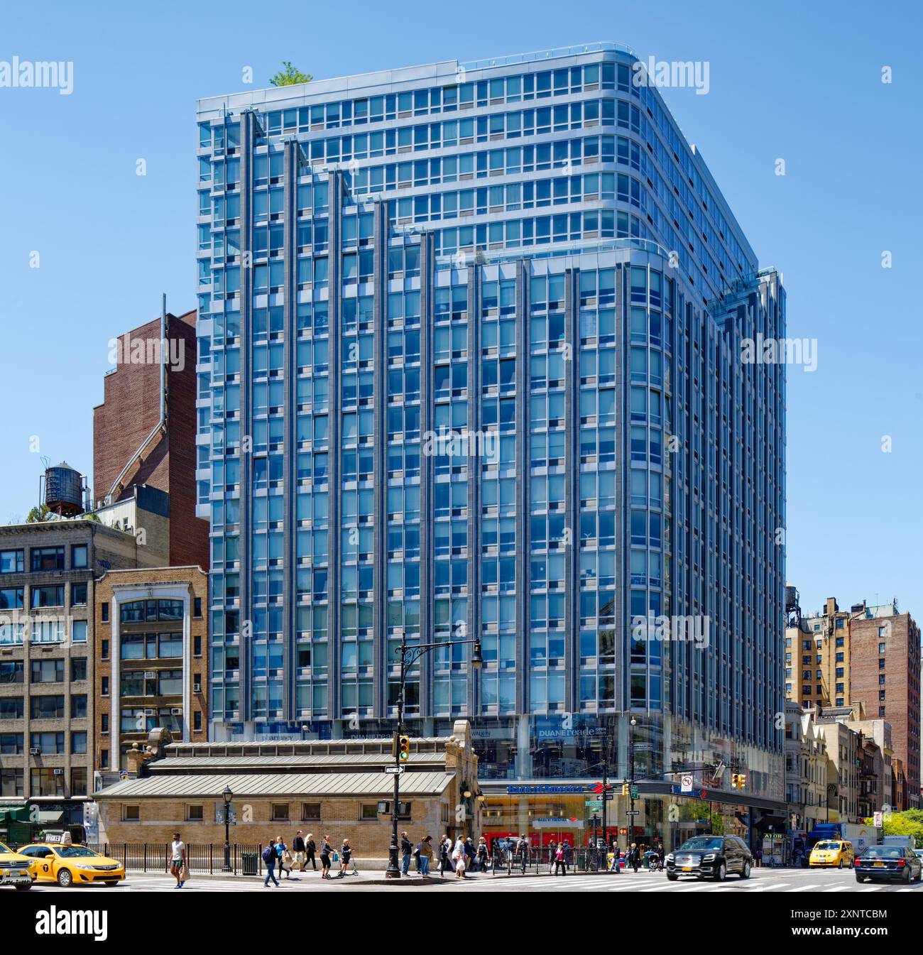The Corner, at West 72nd Street and Broadway, is a 16-story blue glass ...