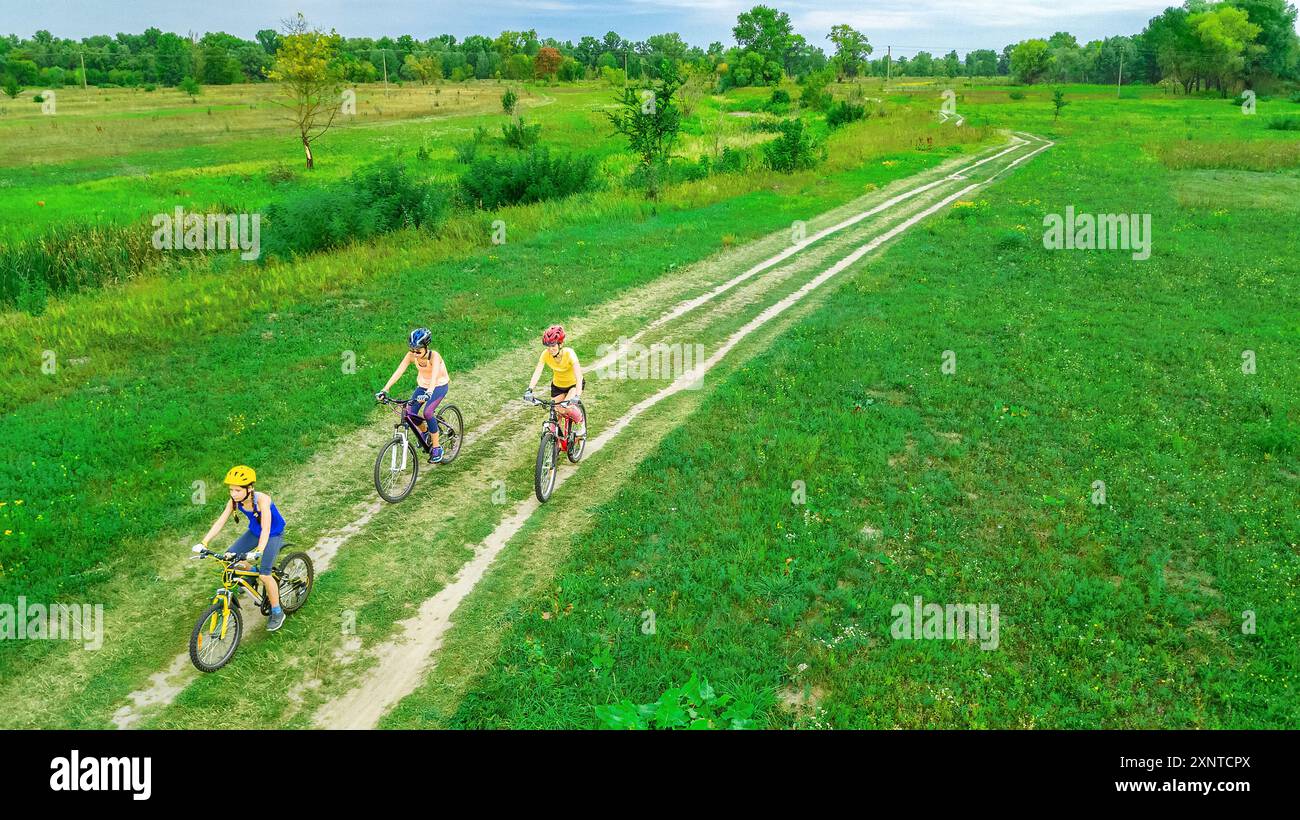 Family cycling on bikes outdoors aerial view from above, happy active ...