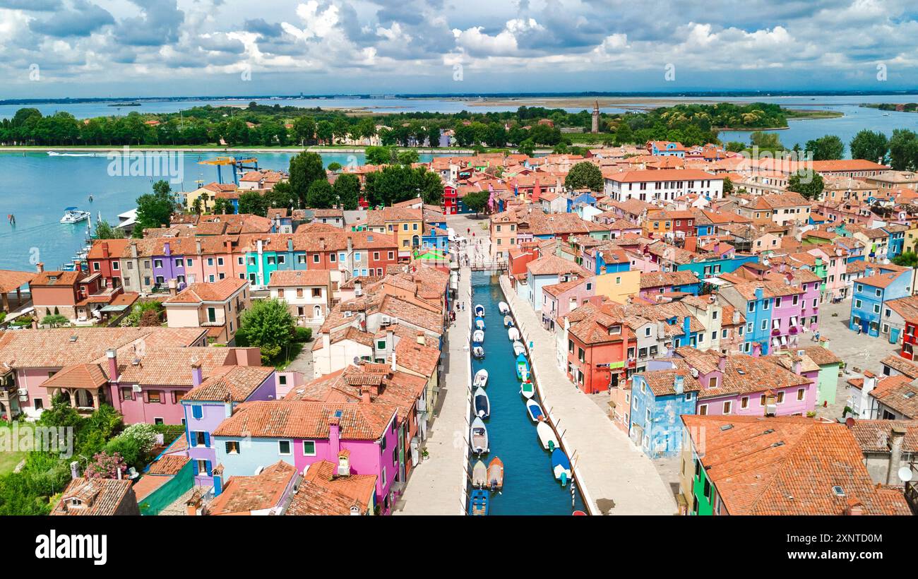 Aerial view of colorful Burano island in Venetian lagoon sea from above ...