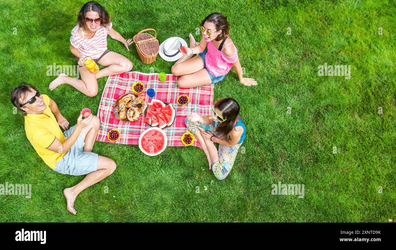 Happy family with children having picnic in park, parents with kids ...