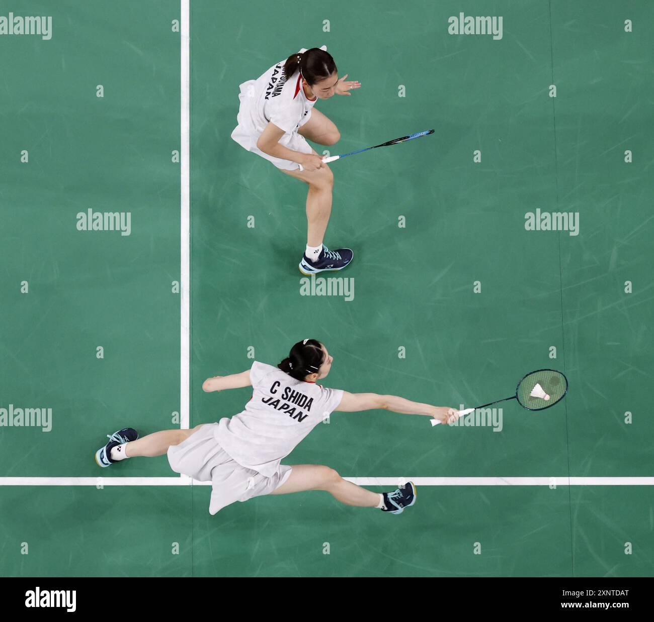 Japan's Chiharu Shida (bottom) and Nami Matsuyama compete in a ...
