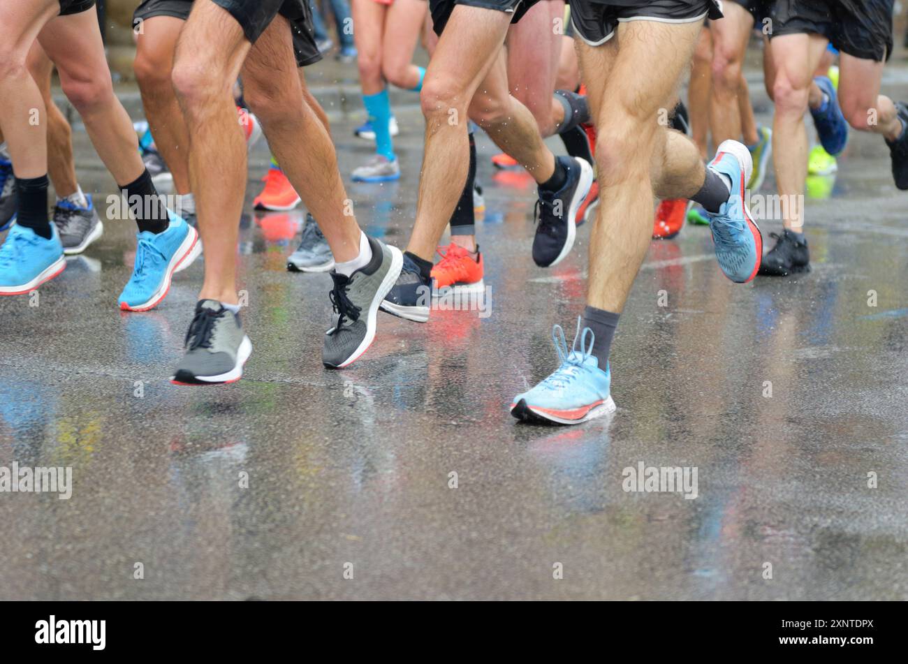 Marathon running race, many runners feet on road racing, sport ...