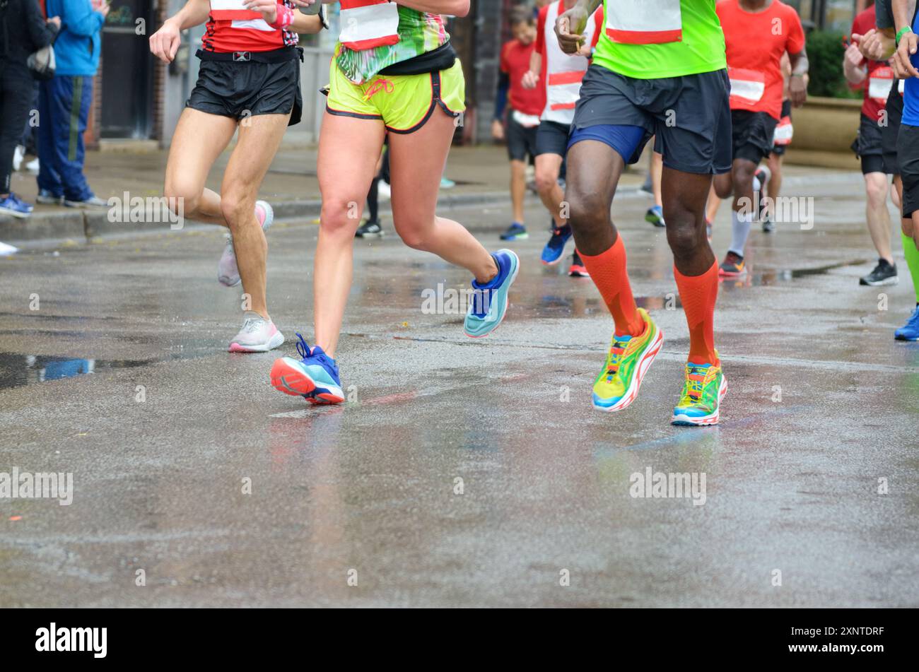 Marathon running race, many runners feet on road racing, sport ...